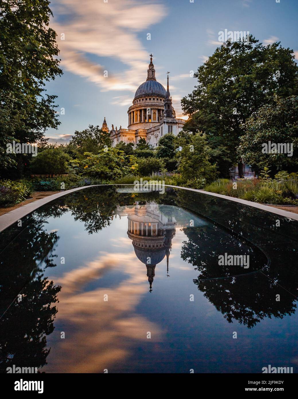 A view of St. Paul's Cathedral through a reflection pool in the city of ...