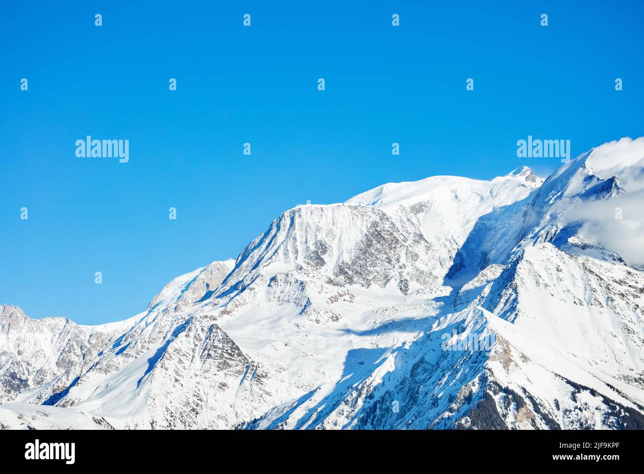 Peaks in snow Mont Blanc Alps mountains massif over blue sky Stock ...
