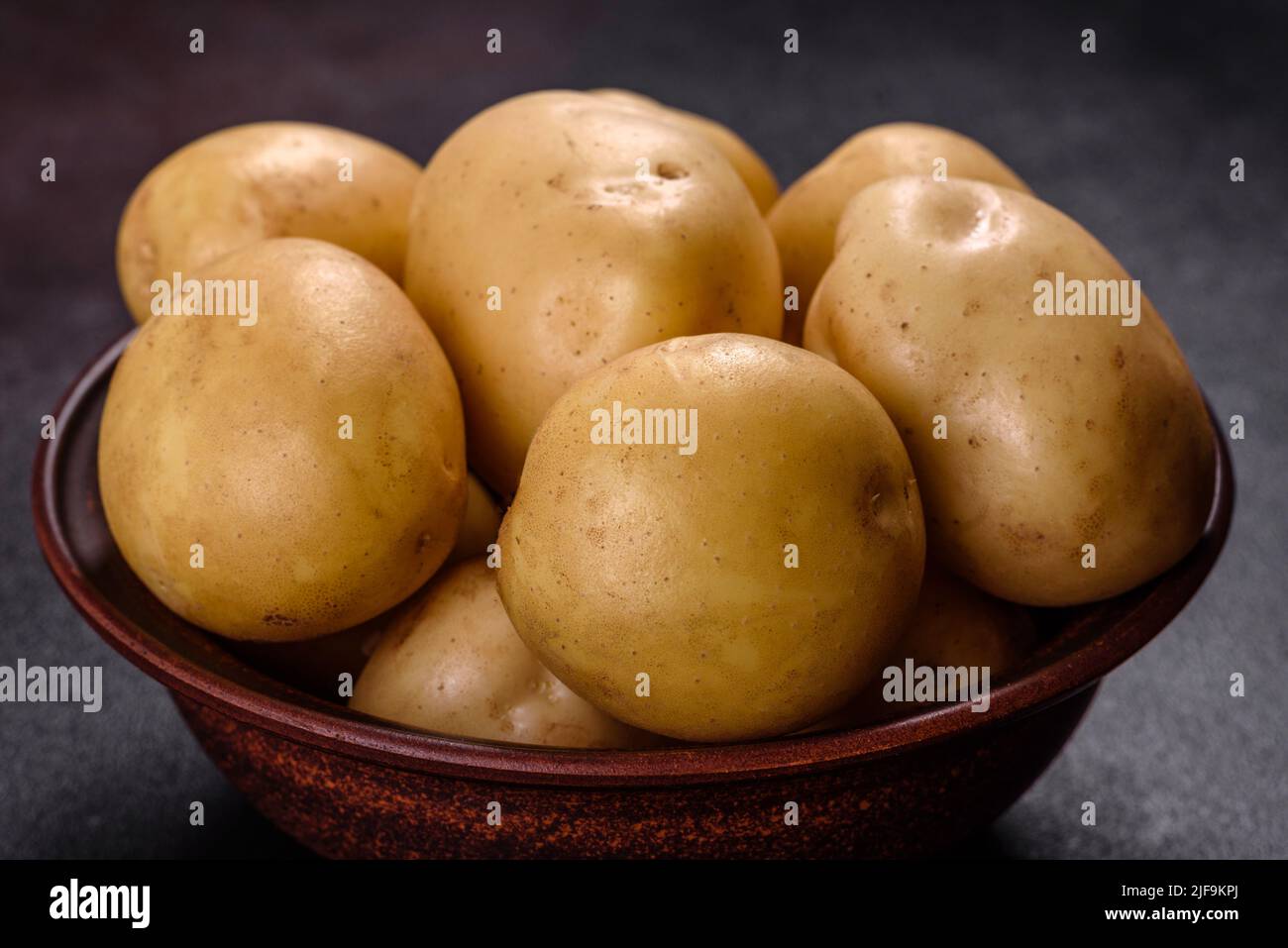 A pile of young potatoes on the table. The benefits of vegetables ...