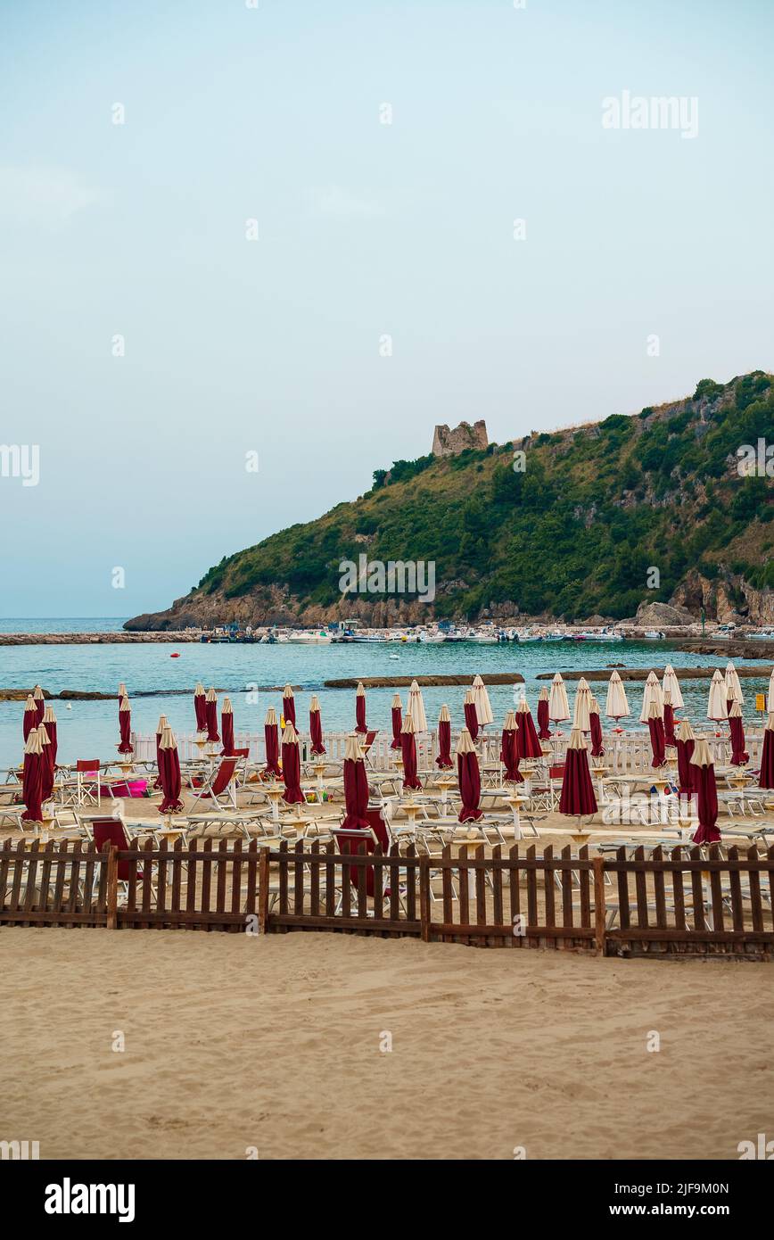 Sun loungers and umbrellas on the beach in Scauri, Italy Stock Photo ...