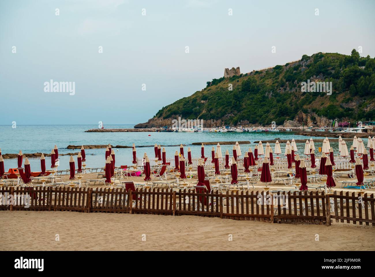 Sun loungers and umbrellas on the beach in Scauri, Italy Stock Photo ...