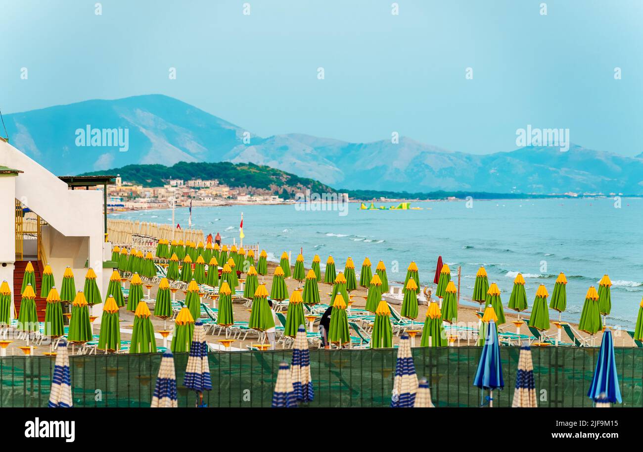 Sun loungers and umbrellas on the beach in Scauri, Italy Stock Photo ...