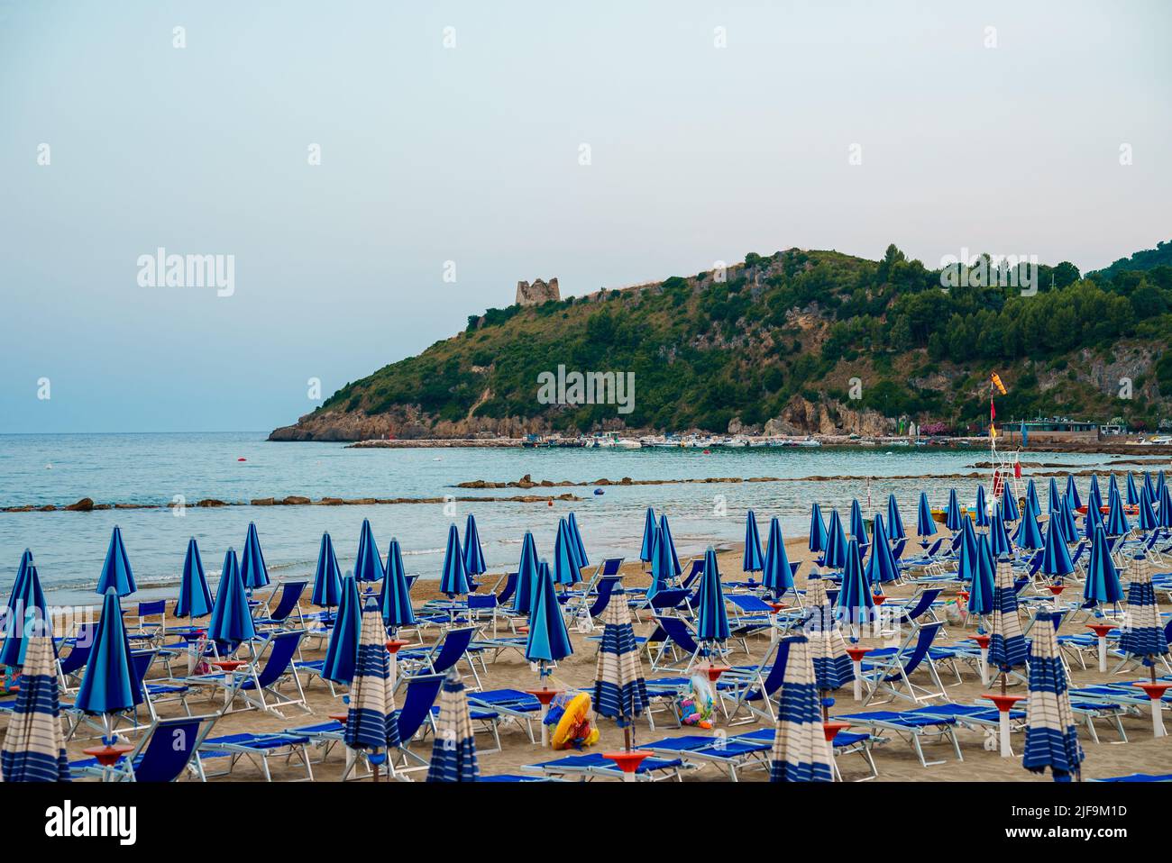Sun loungers and umbrellas on the beach in Scauri, Italy Stock Photo ...
