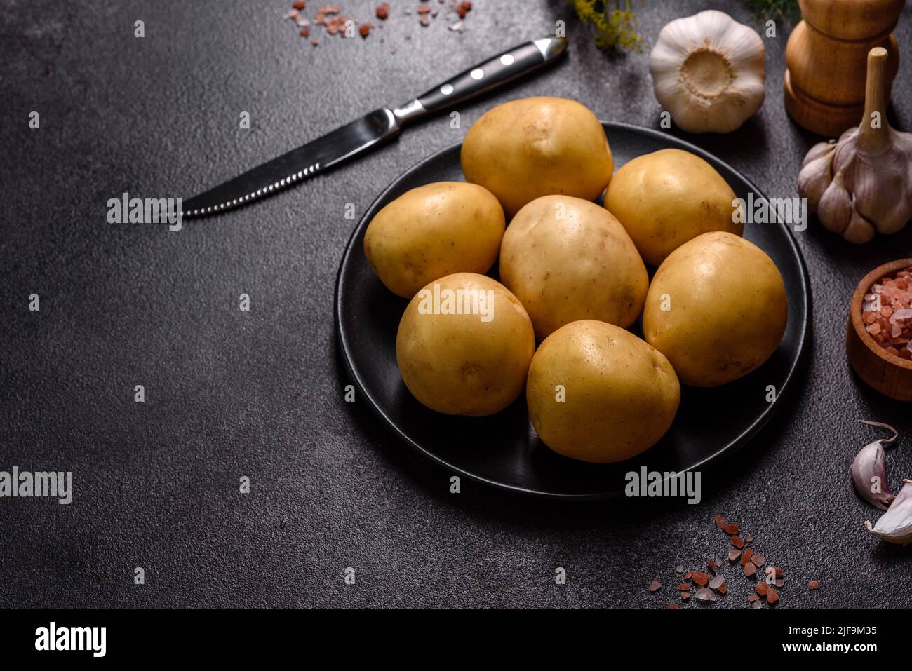 A pile of young potatoes on the table. The benefits of vegetables ...