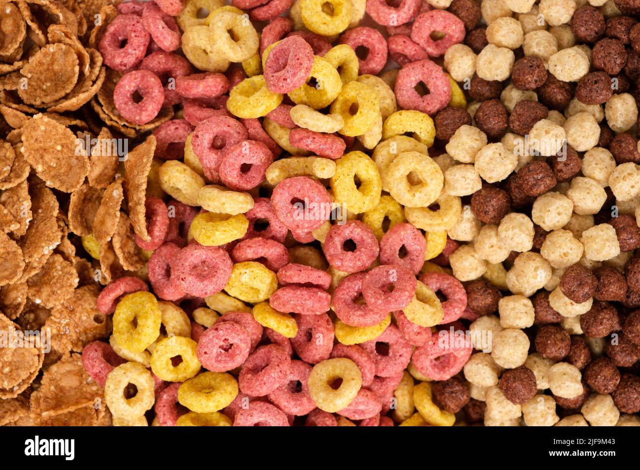 A set of different quick breakfast cereals - rings and balls, top view ...