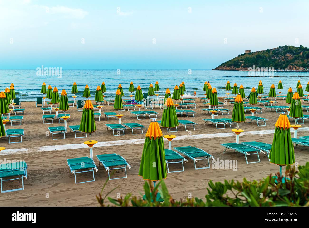 Sun loungers and umbrellas on the beach in Scauri, Italy Stock Photo ...