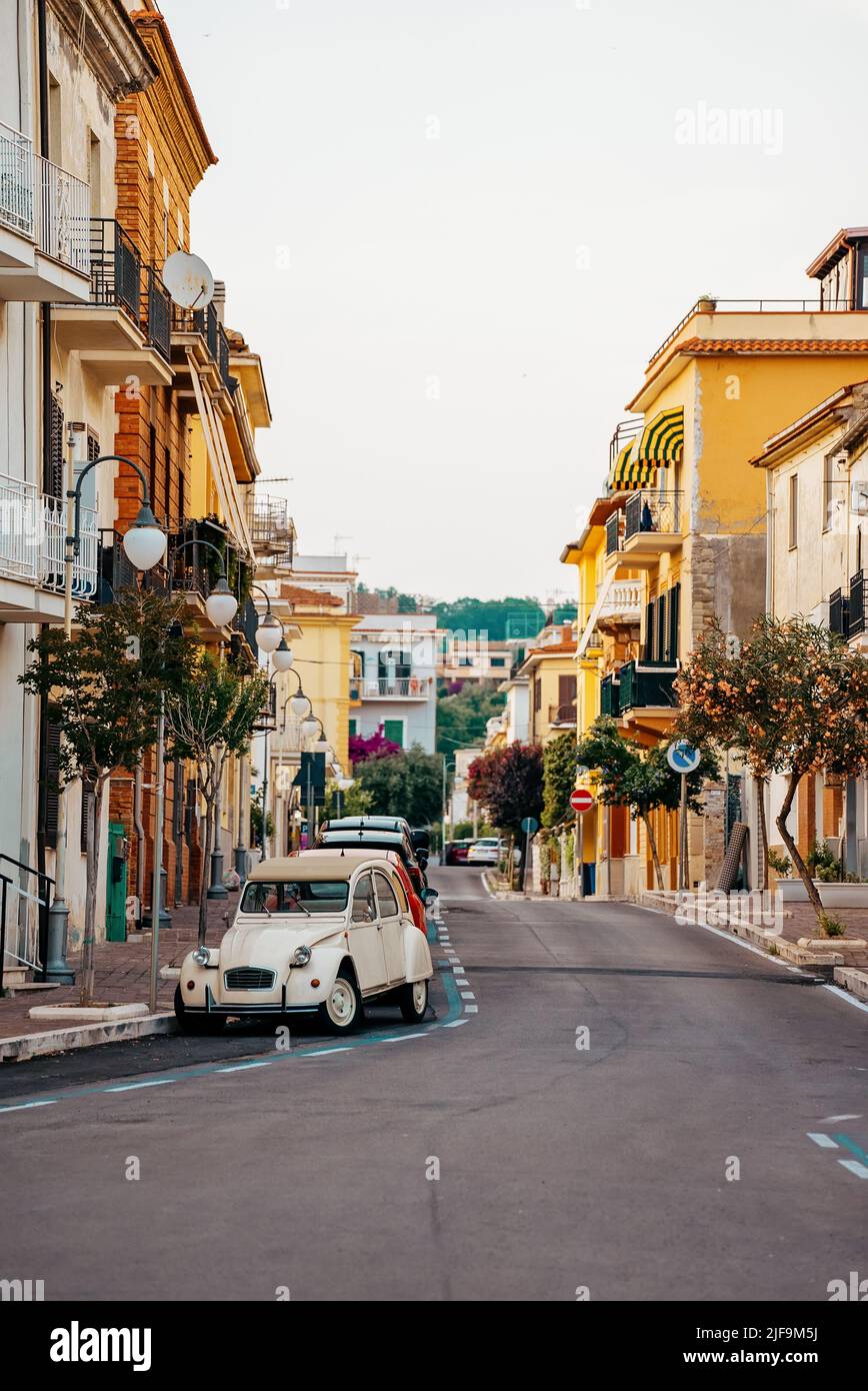 Typical italian street with old car in Scauri, Italy Stock Photo - Alamy