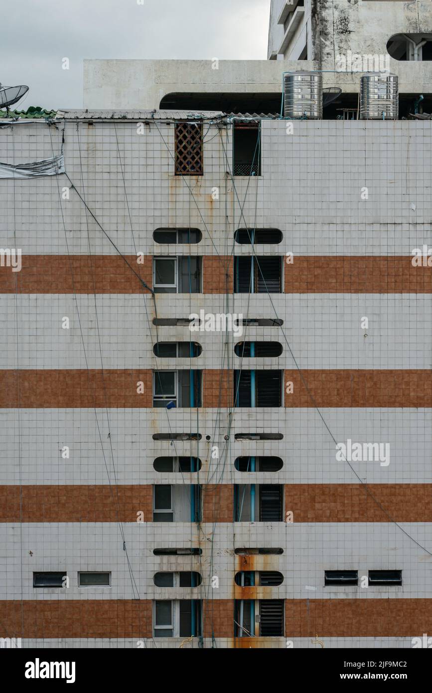 Old dirty facade of building with cables, Bangkok Stock Photo - Alamy