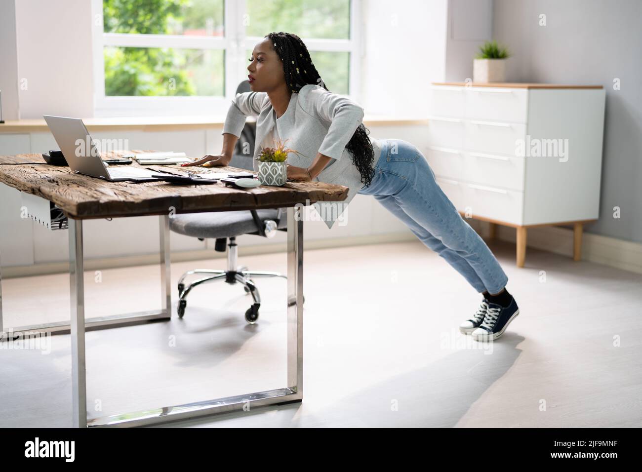 African American Doing Office Exercise Workout Training Stock Photo - Alamy