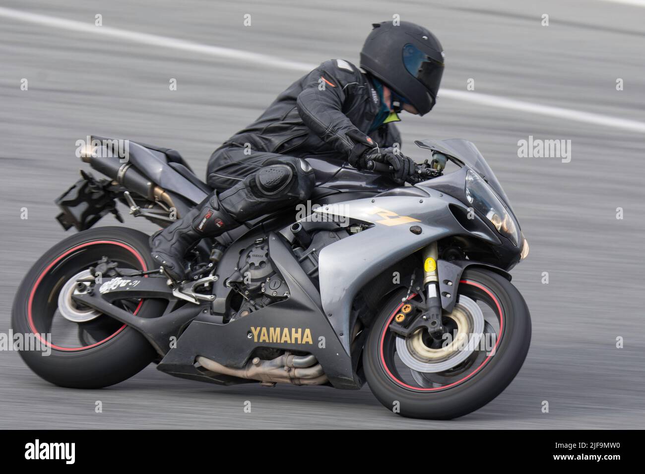 Modern fast sport motor bike in the track. Yamaha R1 Stock Photo - Alamy