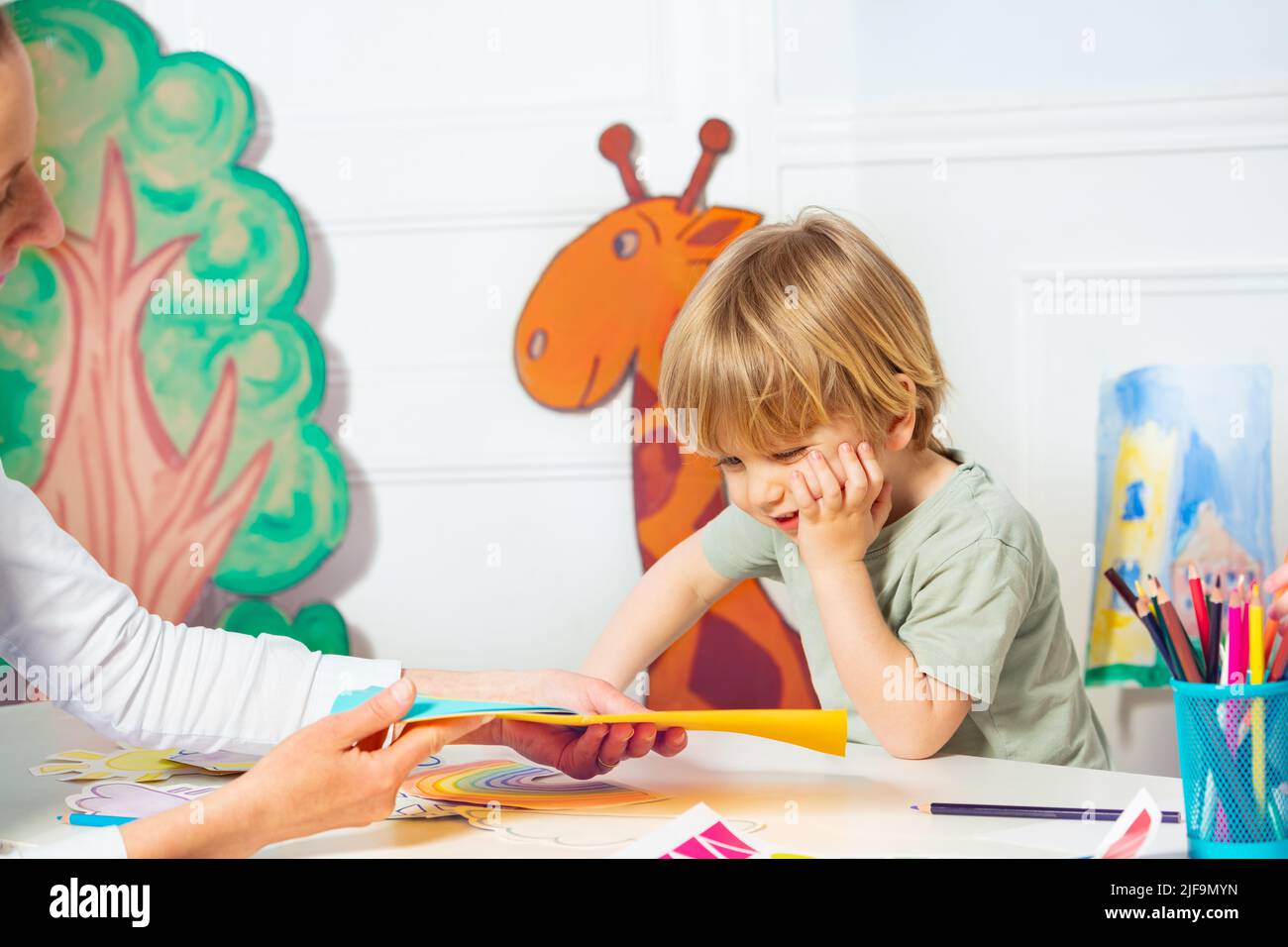 Little boy with interest look stare at the page in book Stock Photo - Alamy