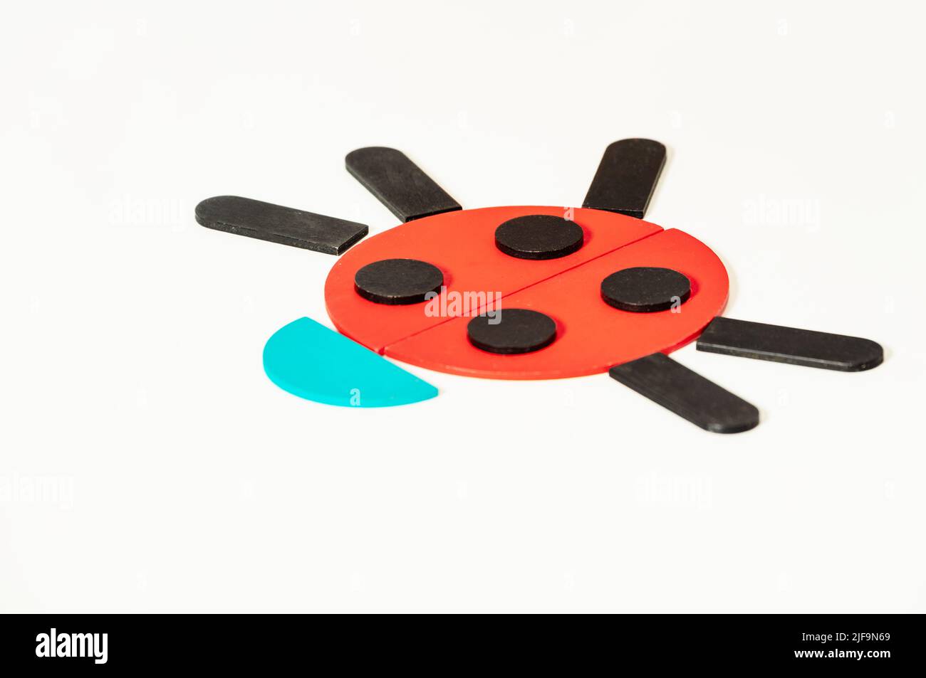 Beetle put together of shapes by a child lay on the table Stock Photo ...