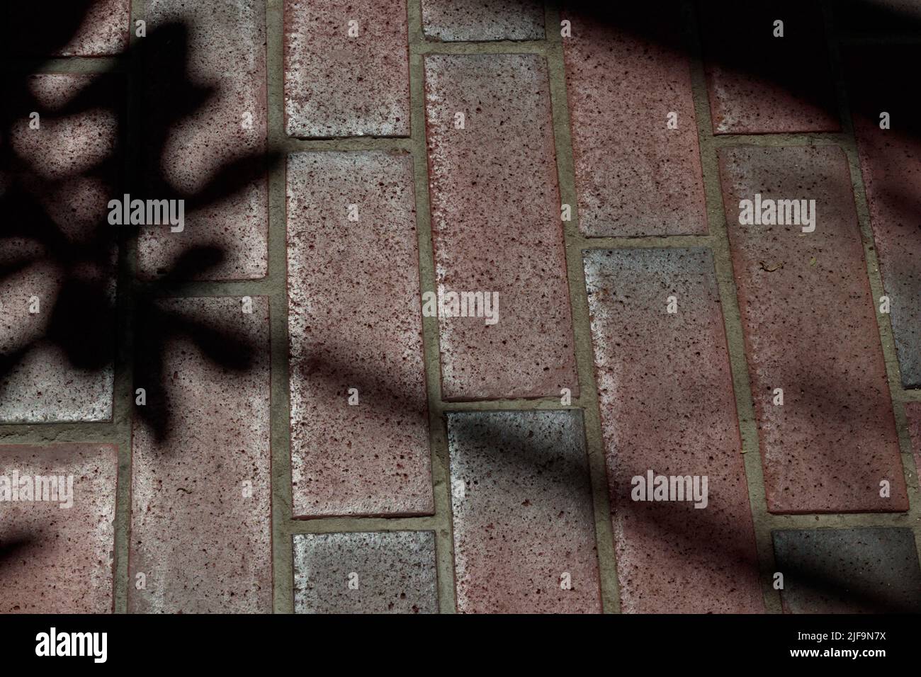 Brick road texture background with shadows Stock Photo - Alamy