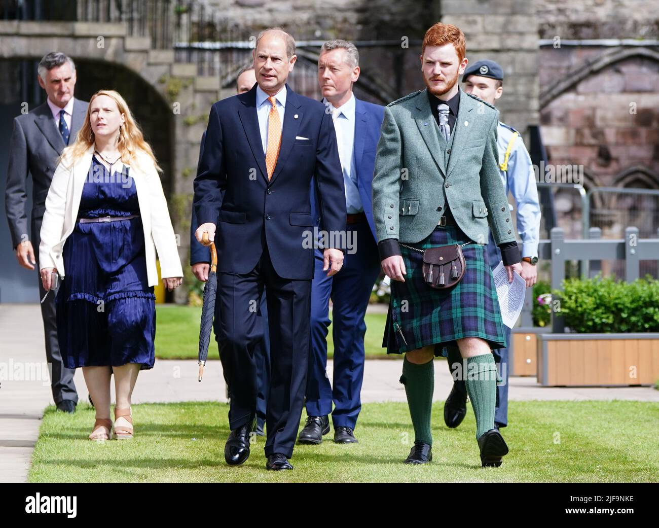 The Earl of Wessex (centre) with Brodie Roberston (right) a Gold award ...