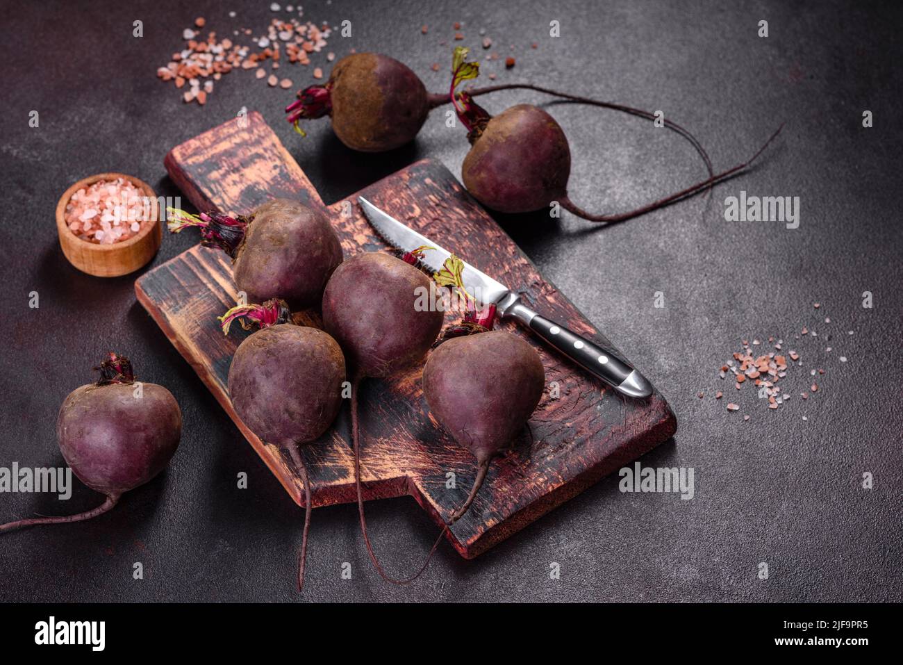 A pile of raw beets on the table. The benefits of vegetables. Harvest ...