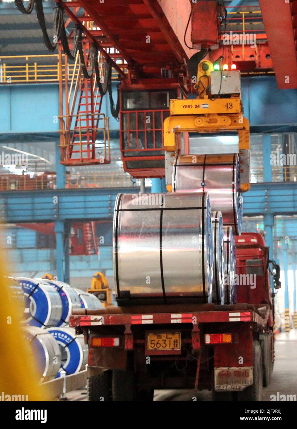 RIZHAO, CHINA - JUNE 30, 2022 - Steel coils are loaded at the workshop of Rizhao Baohua New ...