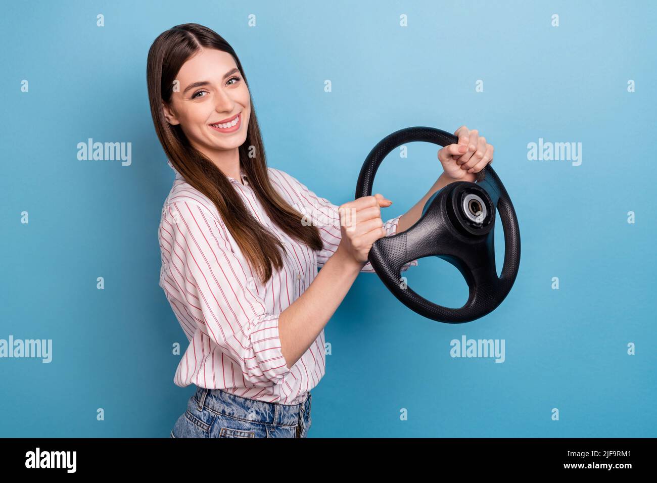 Profile side view portrait of attractive cheerful girl holding steering ...