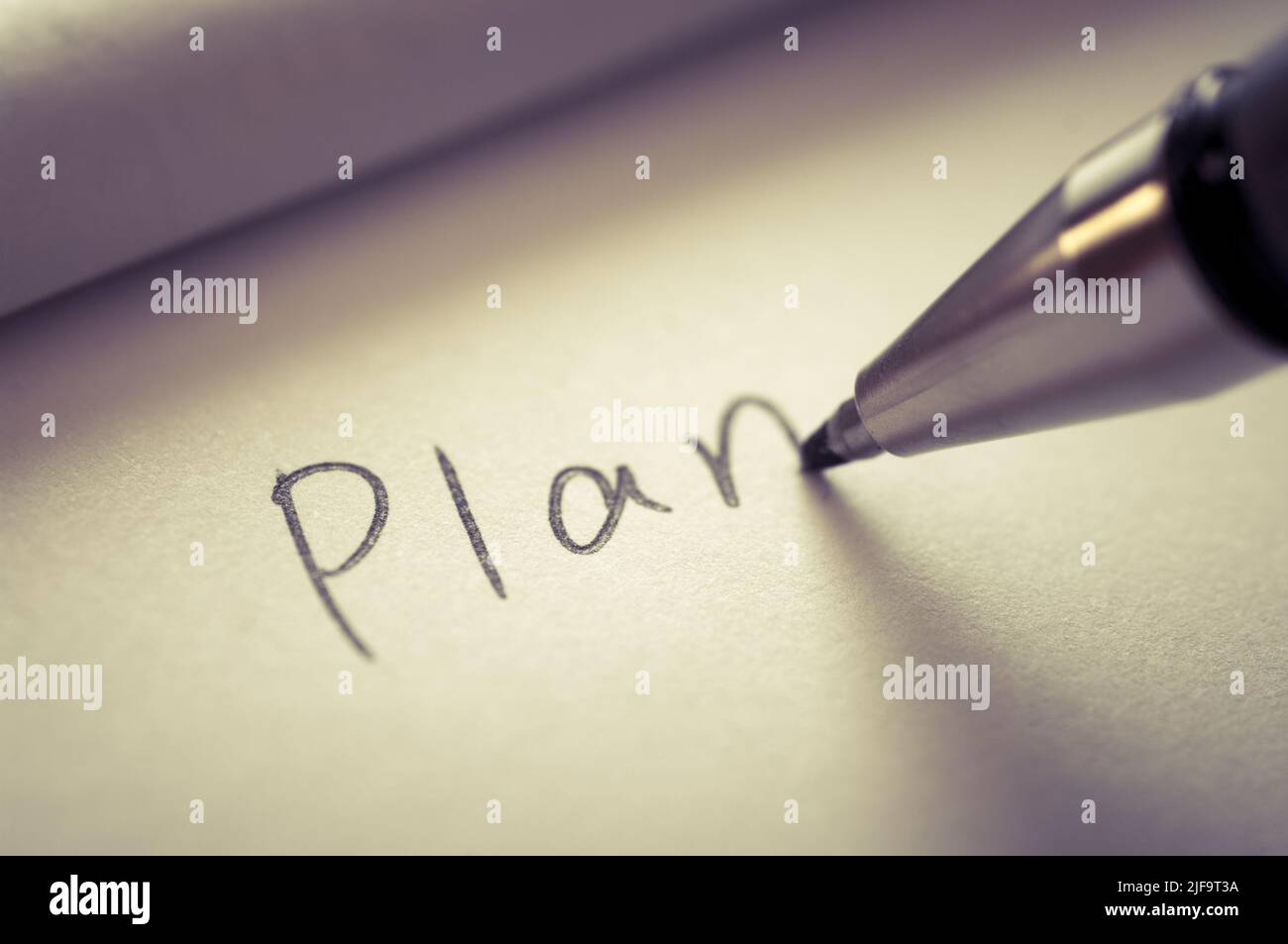 Close up image of writing a word PLAN on a notebook paper Stock Photo ...