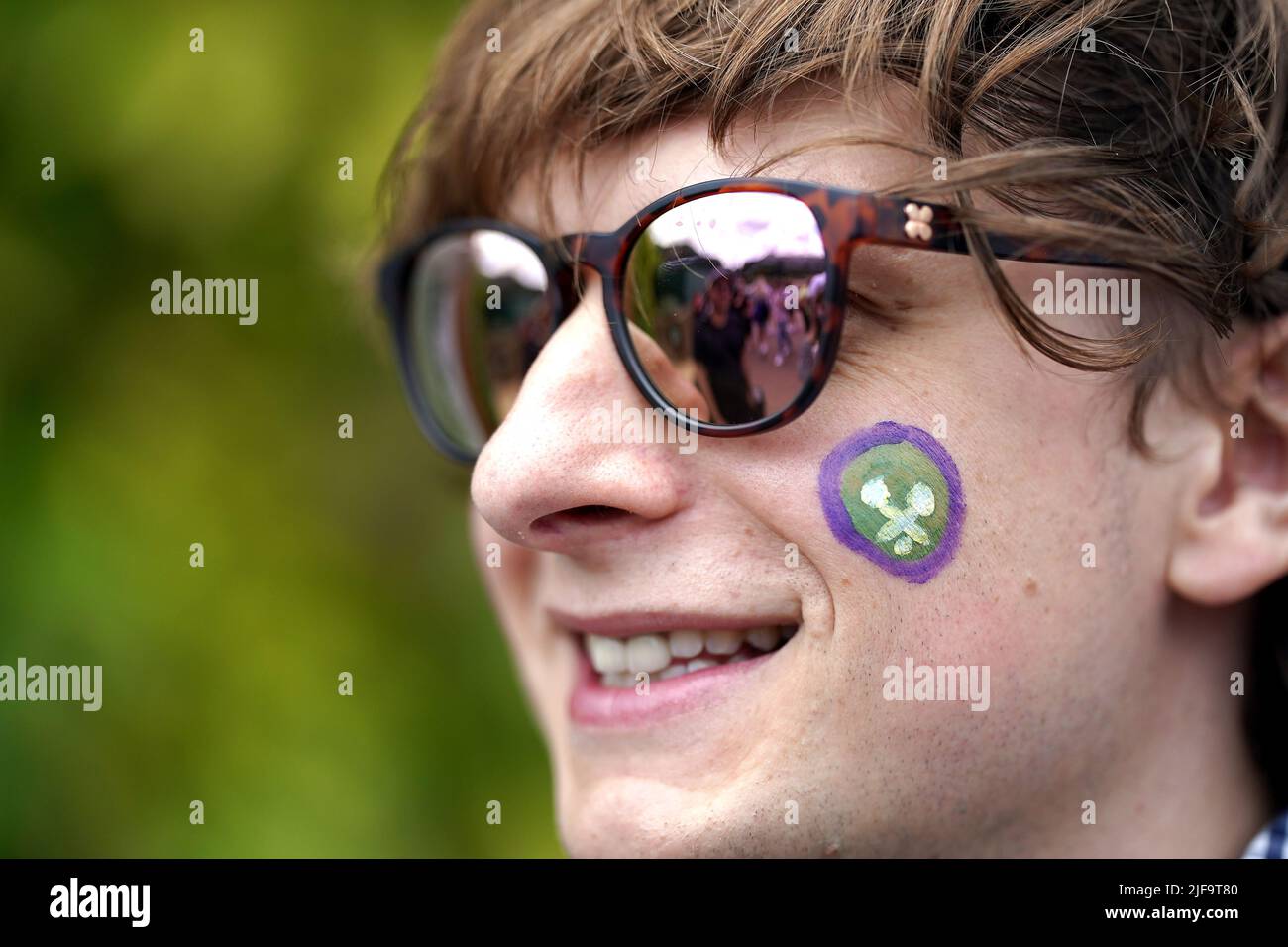 A spectator with Wimbledon inspired face paint during day five of the ...