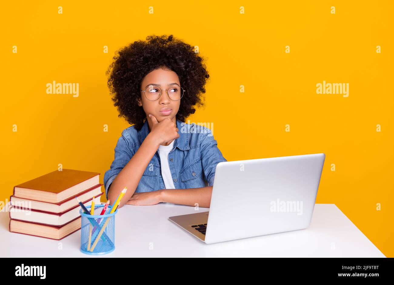 Portrait of beautiful trendy minded teen girl learner preparing project ...