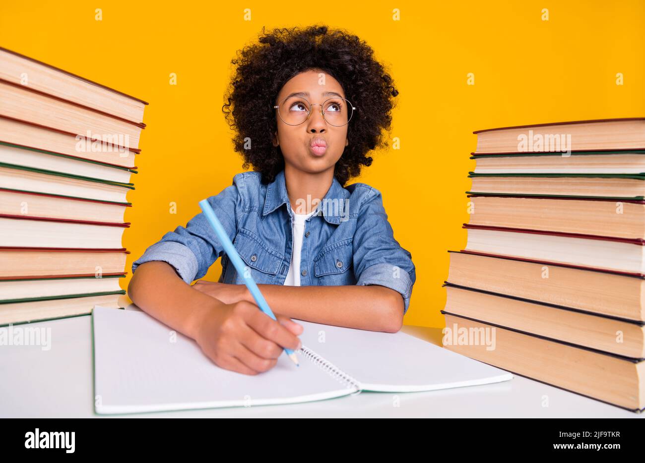 Portrait of attractive creative clever minded girl writing essay task ...