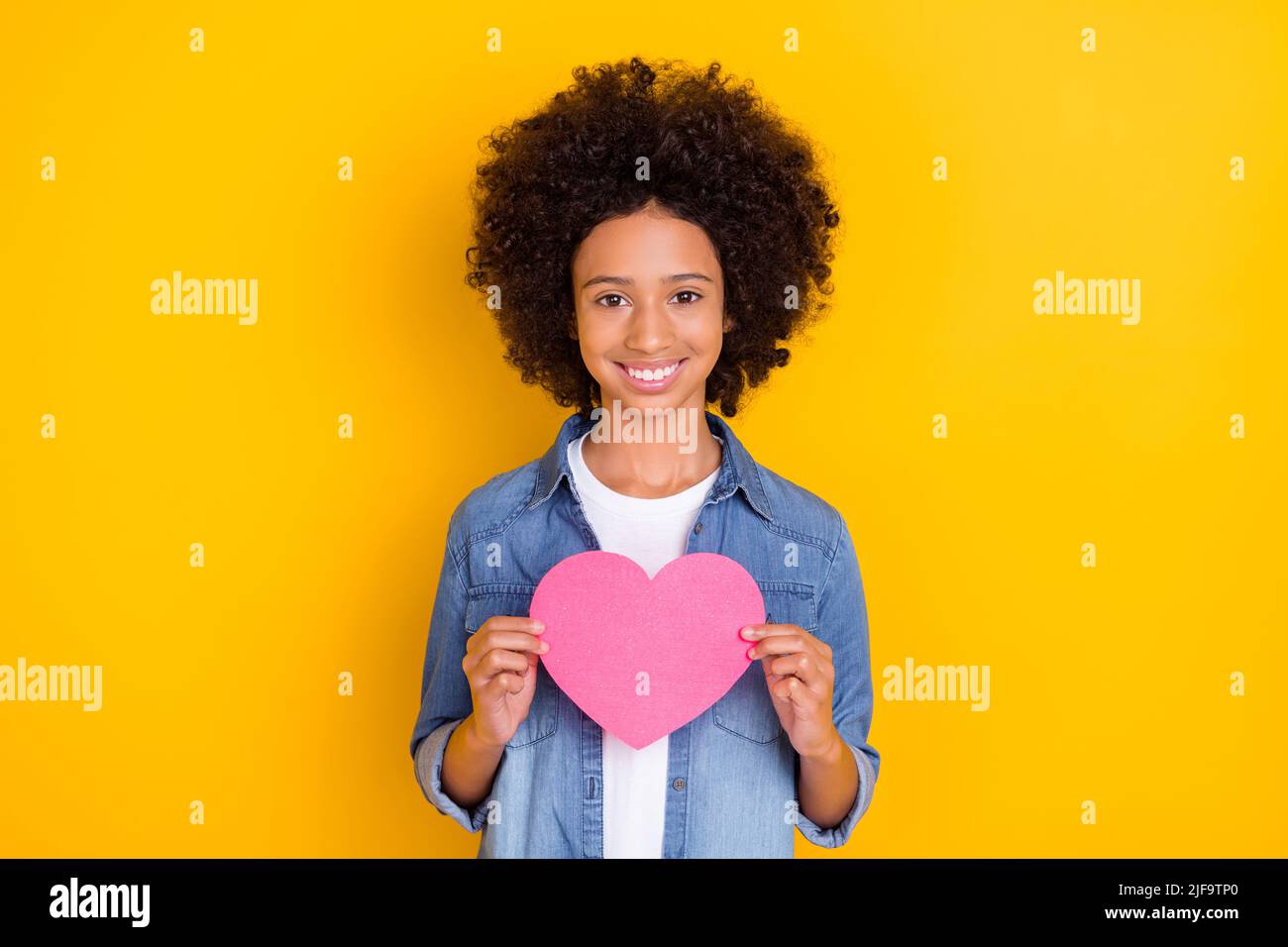 Portrait of beautiful trendy cheery teen-aged girl holding in hands ...