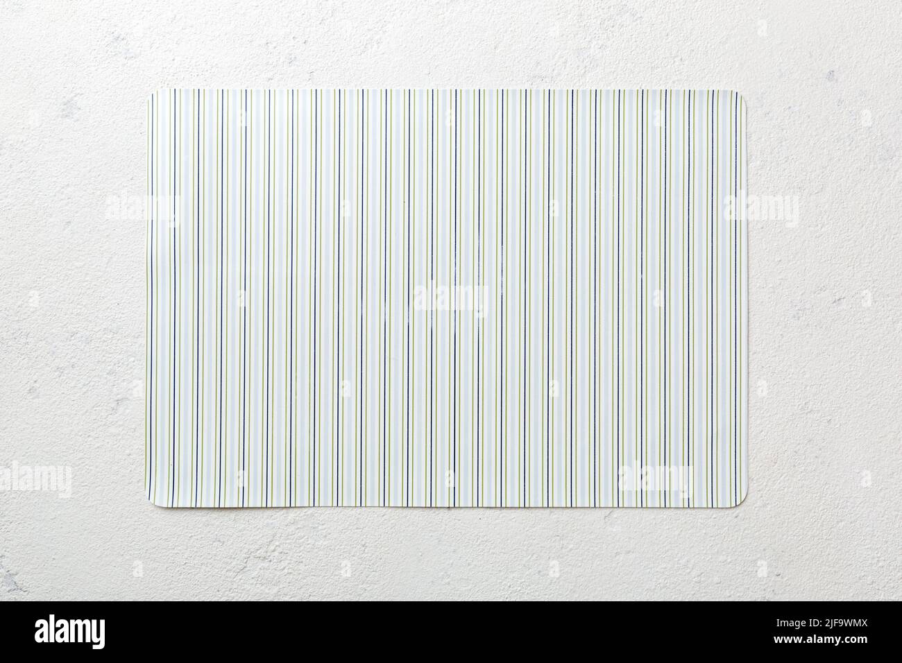 Top view of light tablecloth for food on cement background. Empty space ...