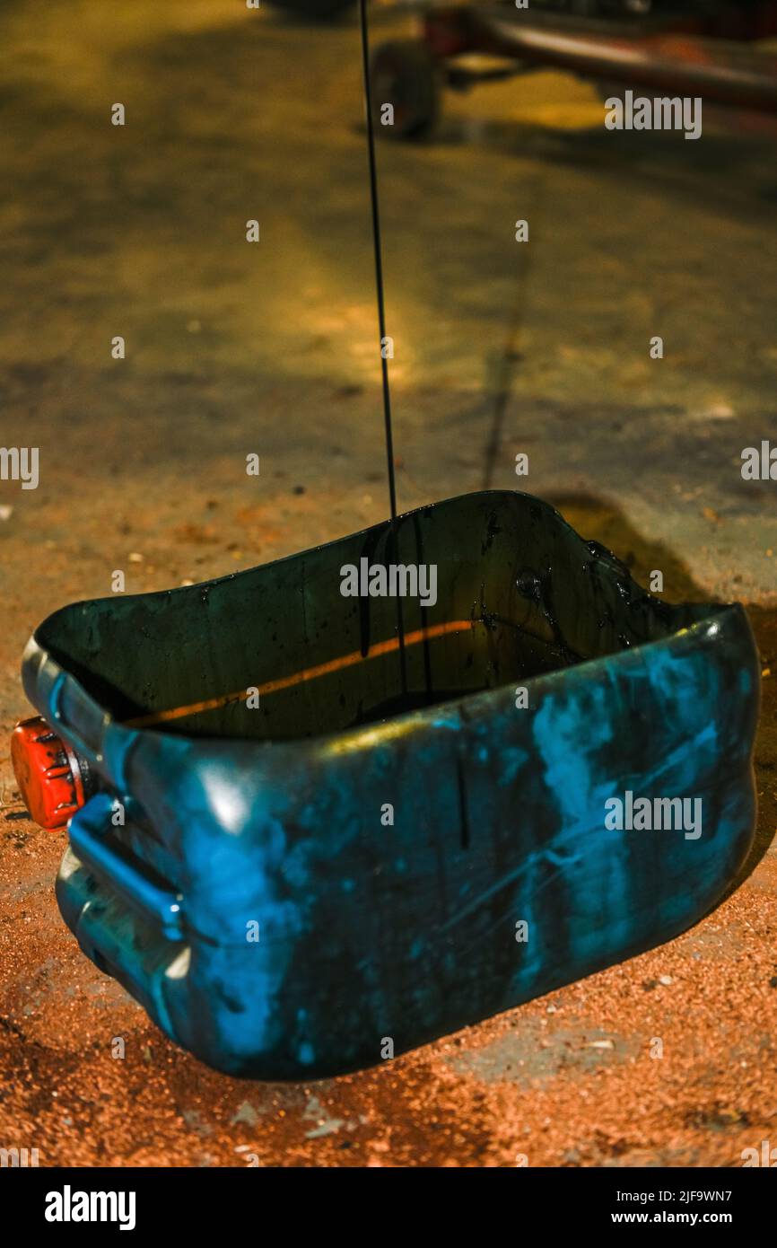 Homemade container for collecting engine oil Stock Photo - Alamy