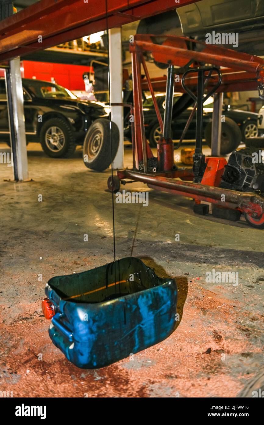 Homemade container for collecting engine oil Stock Photo - Alamy