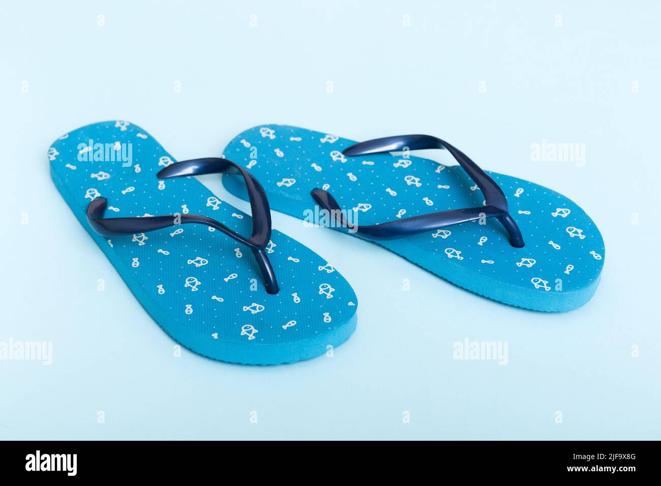 Beach accessories. Flip flops and starfish on colored background. Top ...