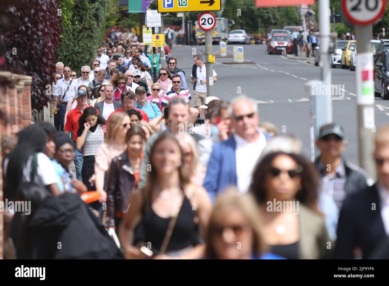 Crowds flock to Wimbledon from Southfields Station, on day five of the ...
