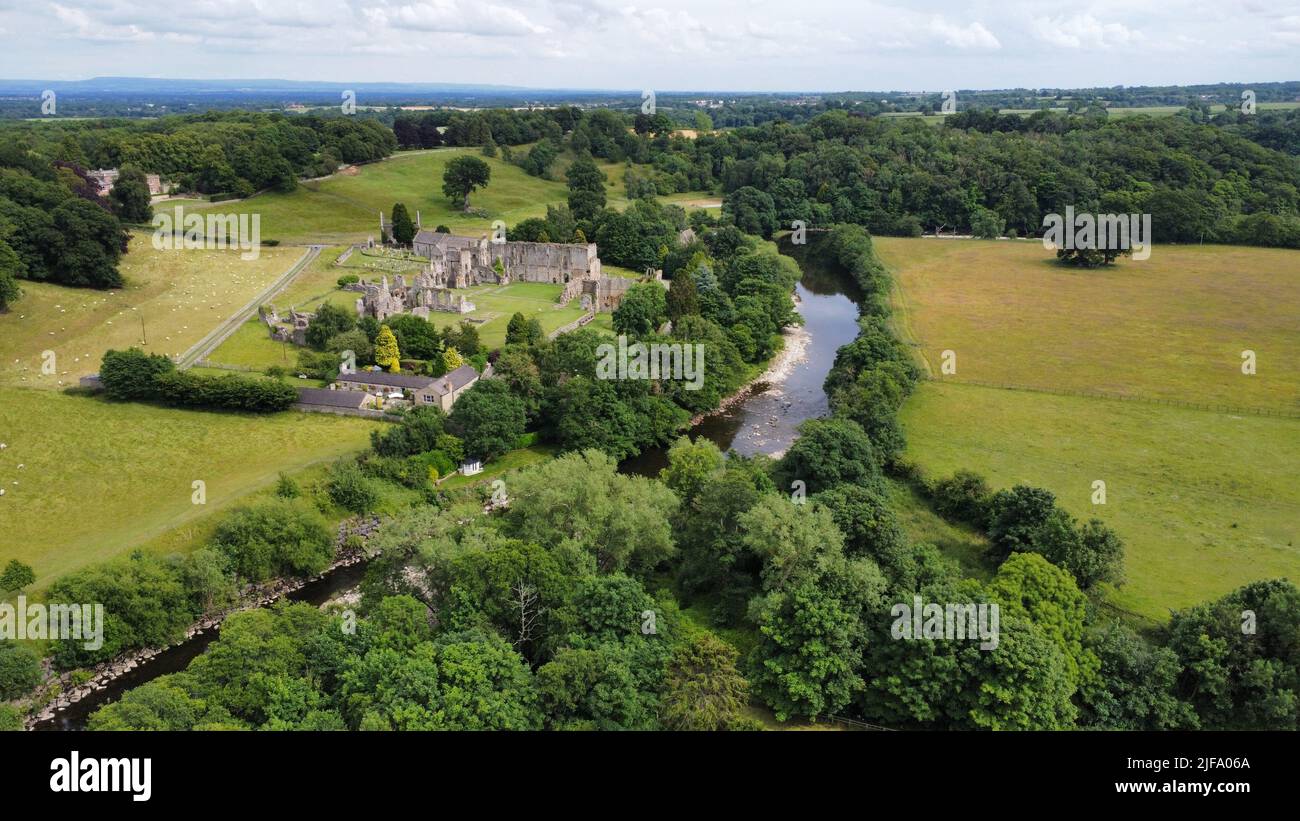 An aerial view of old ruins of a building in a rural area surrounded by ...