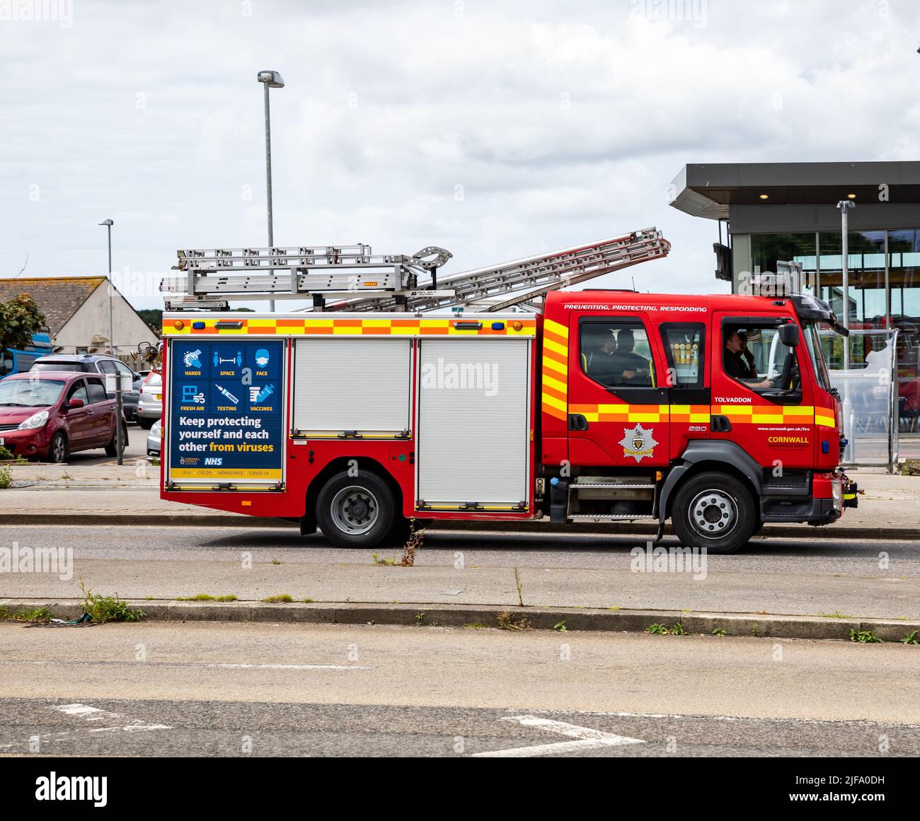 Fire engine driving through Camborne in Cornwall,UK Stock Photo - Alamy