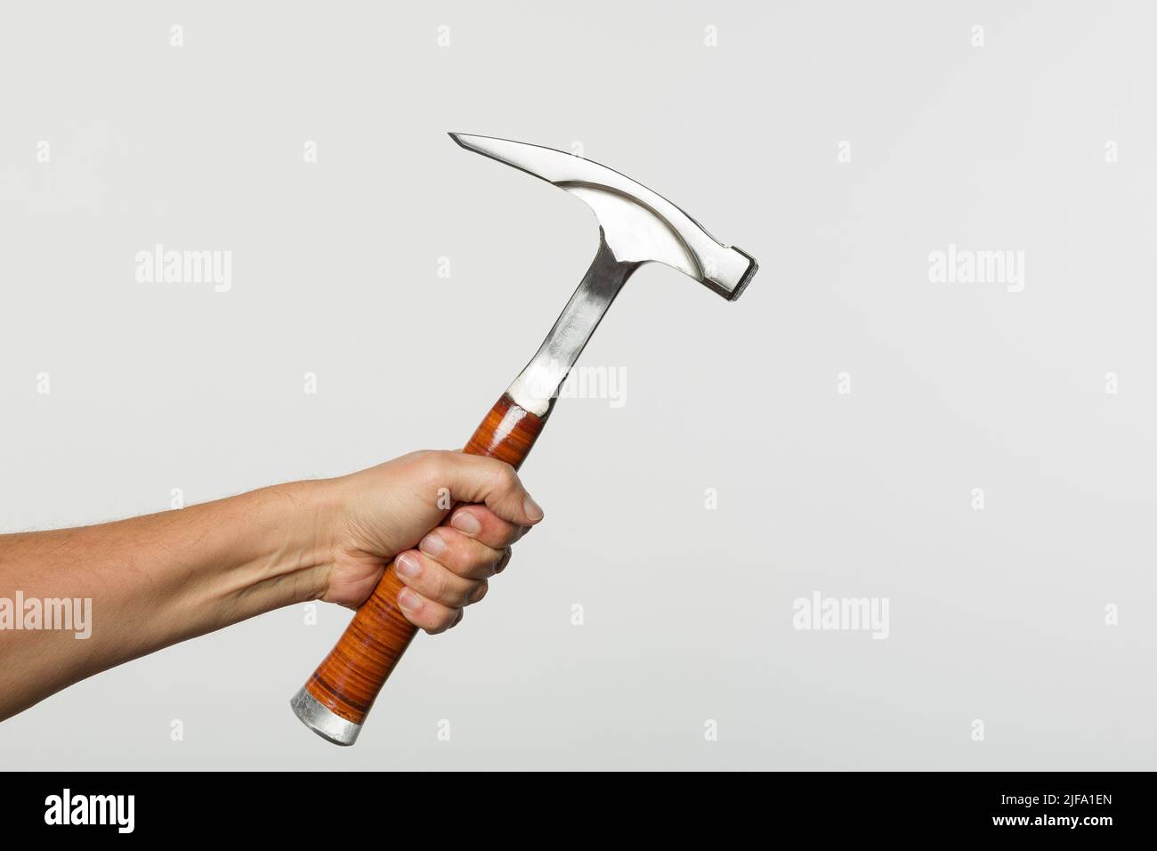 close-up of a hand holding a carpenters hammer Stock Photo - Alamy