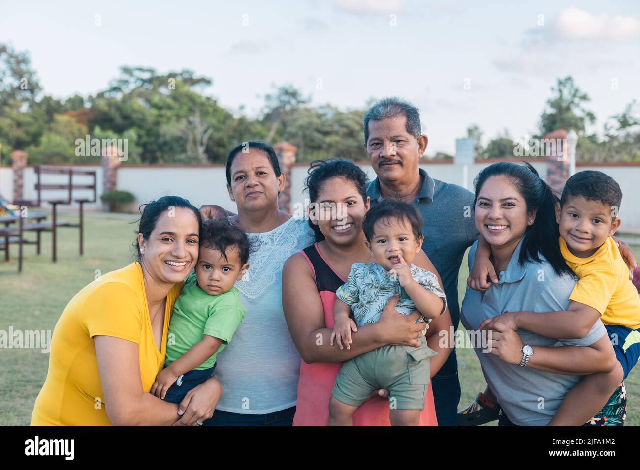 Latino family having fun in the park, everyone happy Stock Photo - Alamy