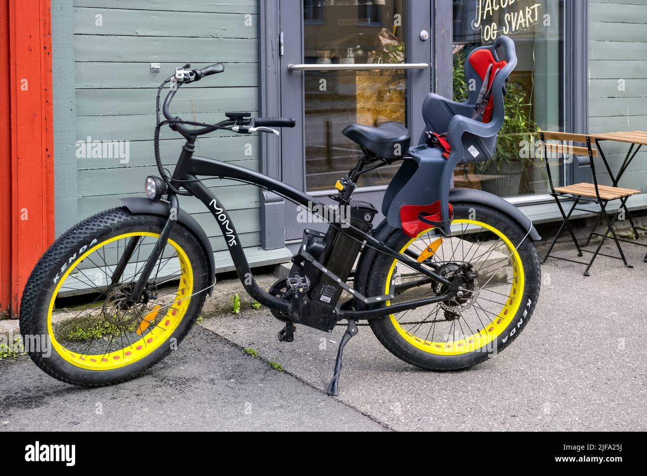 Large parent and child bicycle with bright yellow wheel rims, Trondheim ...