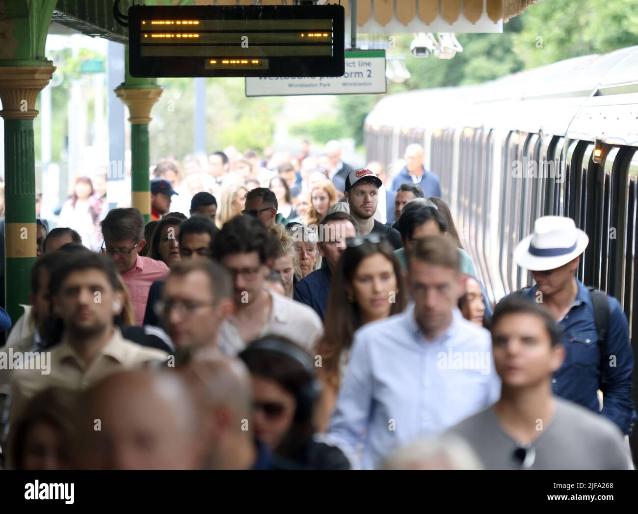Crowds disembark trains at Southfields Station of day five of the 2022 ...