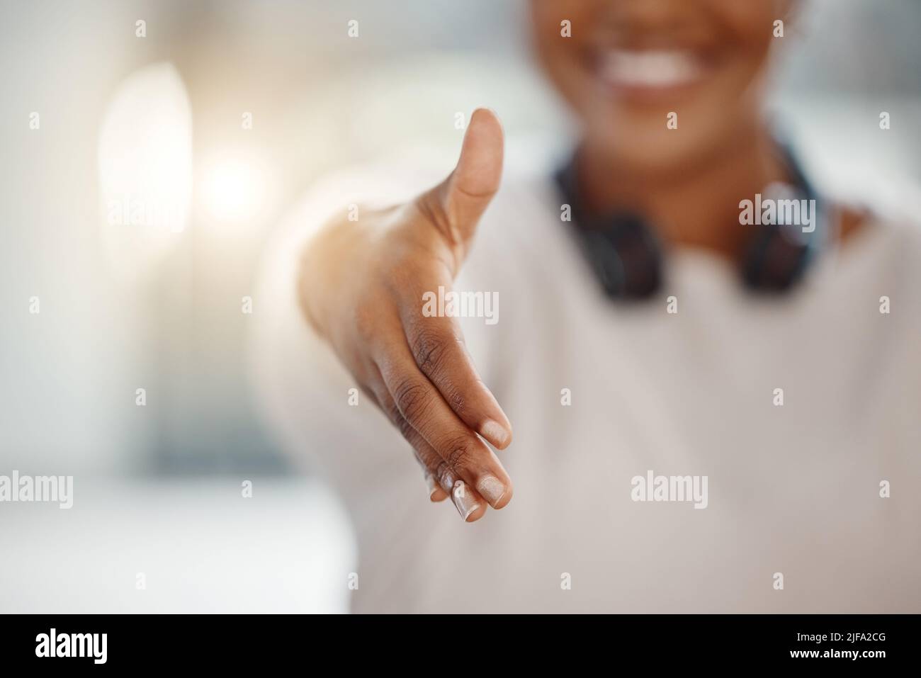 Closeup of one african american businesswoman extending hand forward to ...