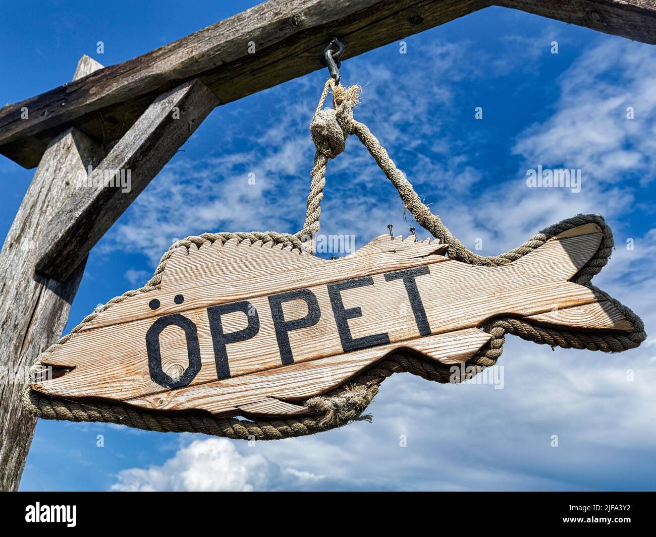 Sign in the shape of a fish with the inscription oeppet, opened ...