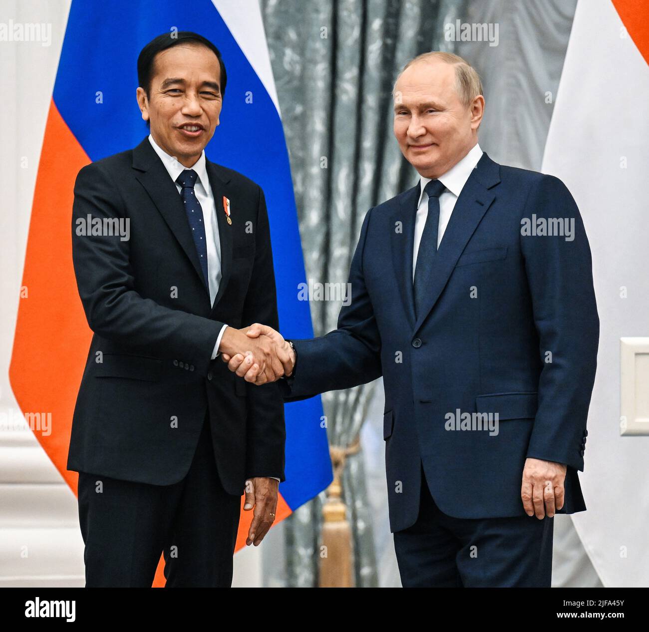 Russian President Vladimir Putin (right) and Indonesian President Joko ...