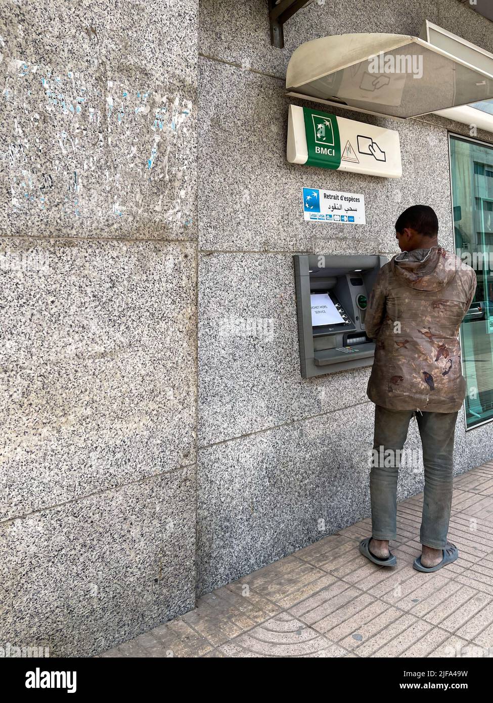 Homeless guy by bank hi-res stock photography and images - Alamy