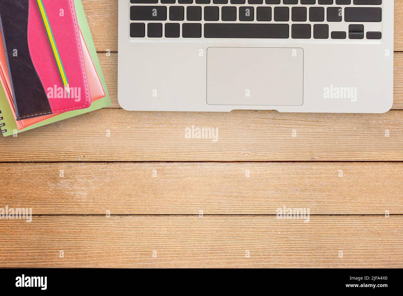 Notebooks and laptop on office desk or wood table. top view with copy ...