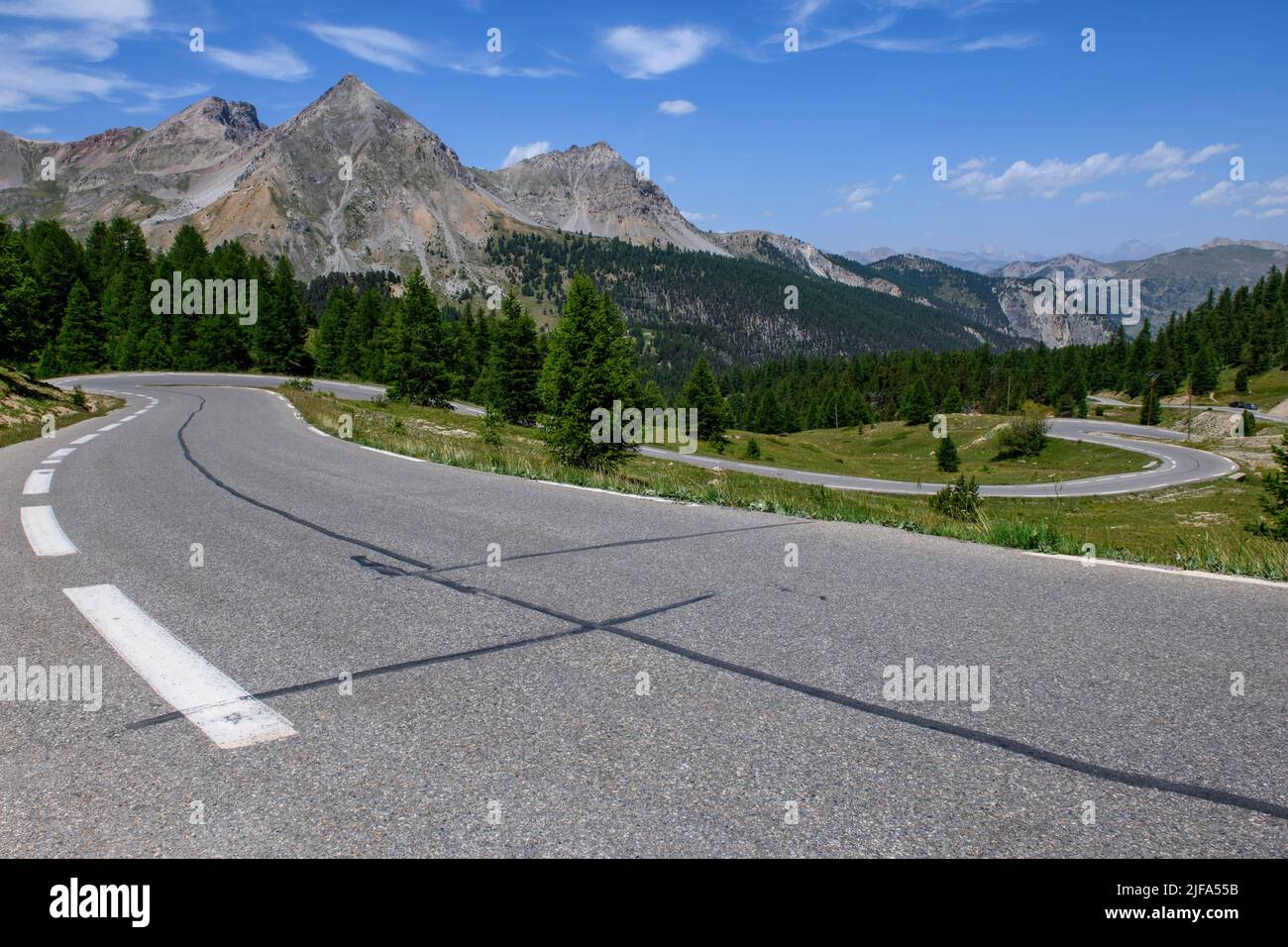 Panoramic view of winding alpine road Mountain road in front of Col de ...