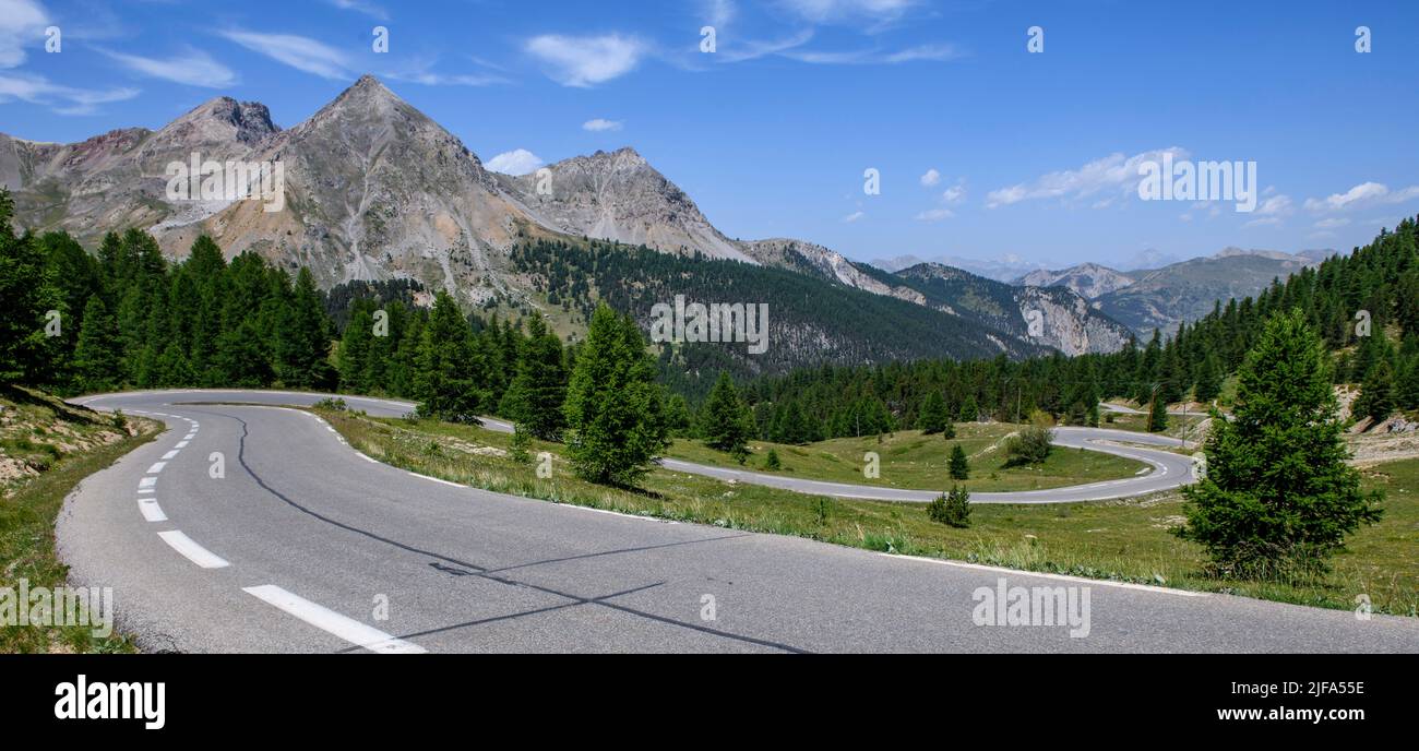 Panoramic view of winding alpine road Mountain road in front of Col de ...