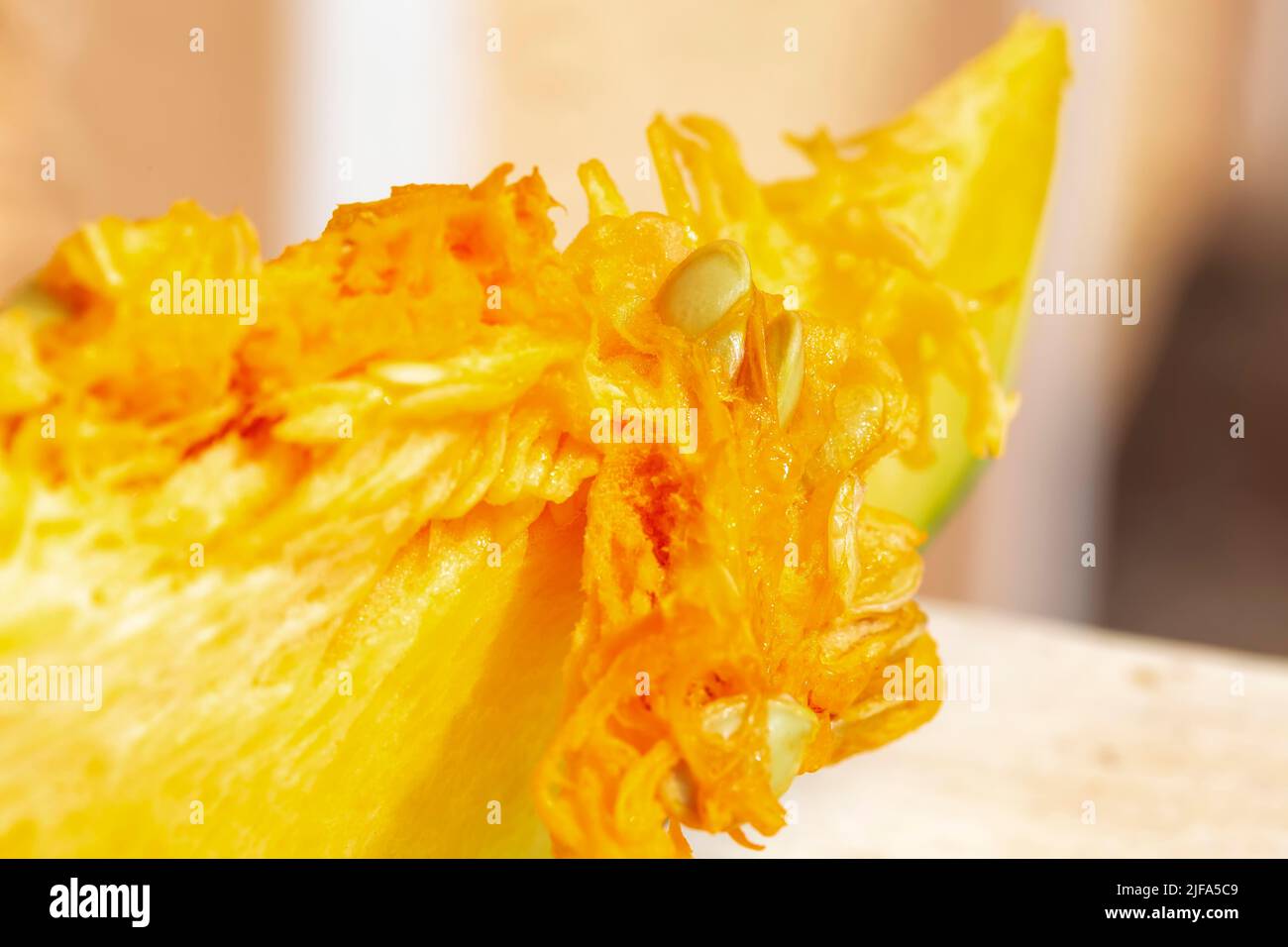 Macro shot of sliced pumpkin with pulp and seeds Stock Photo - Alamy