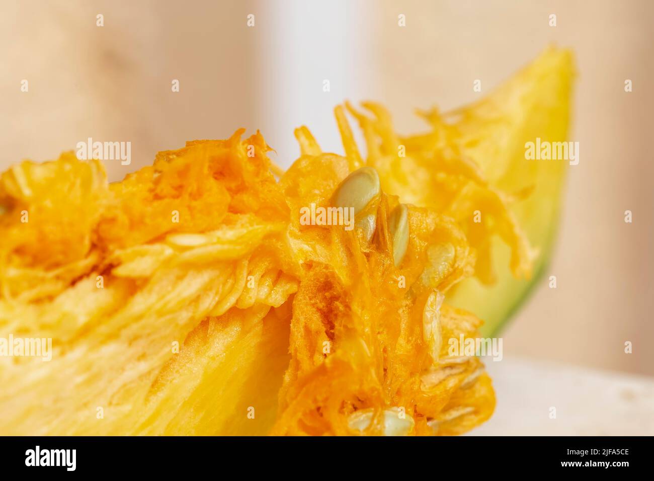 Macro shot of sliced pumpkin with pulp and seeds Stock Photo - Alamy
