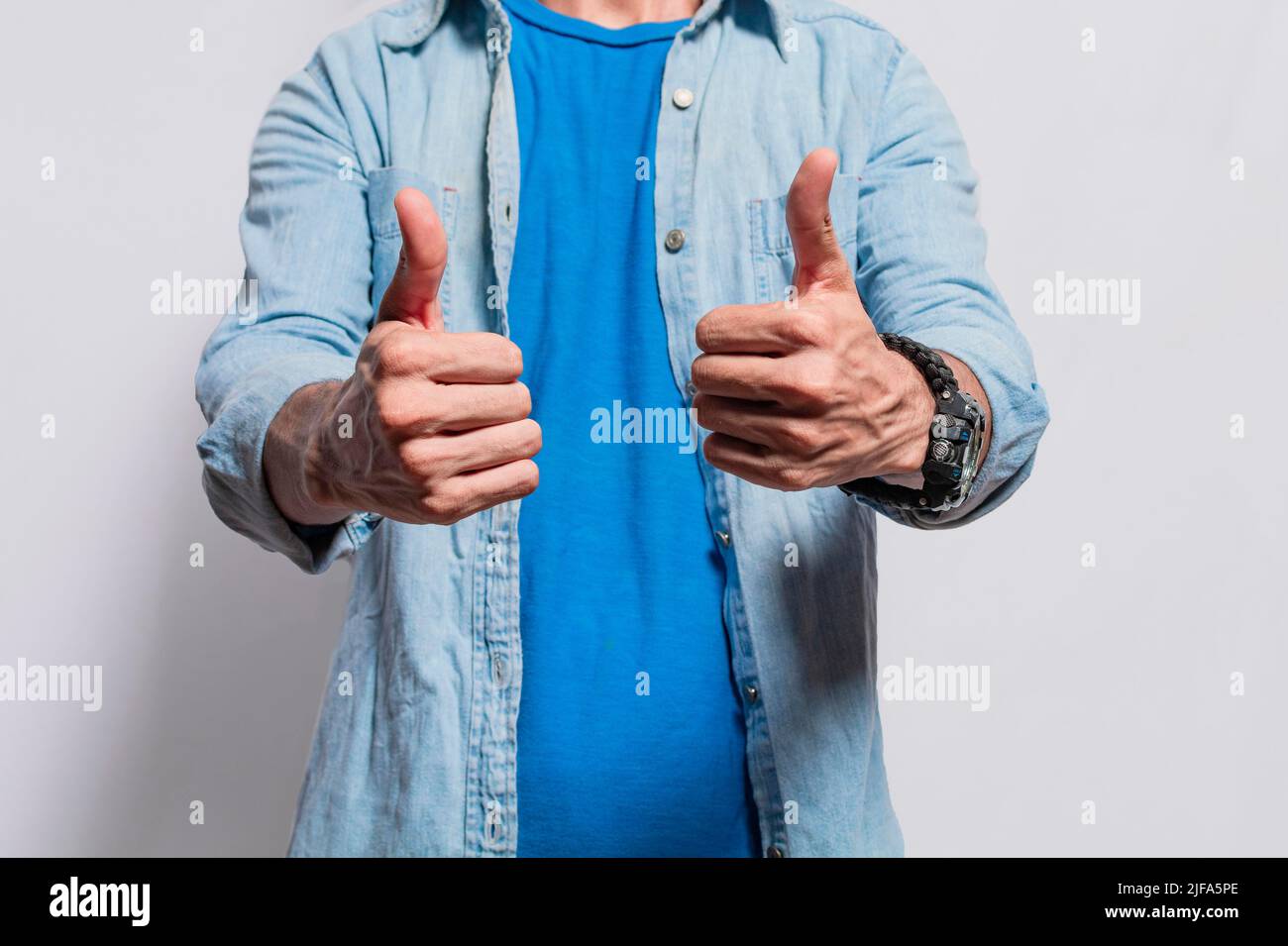 Person hands with thumbs up doing ok, Close up of man hands doing ...