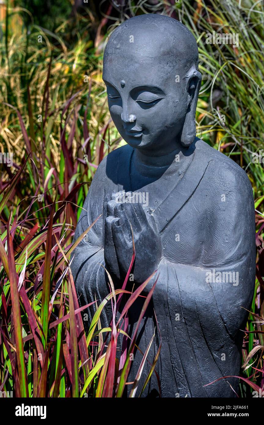 Praying Buddha figure, DIY store, Kempten, Allgaeu, Bavaria, Germany ...