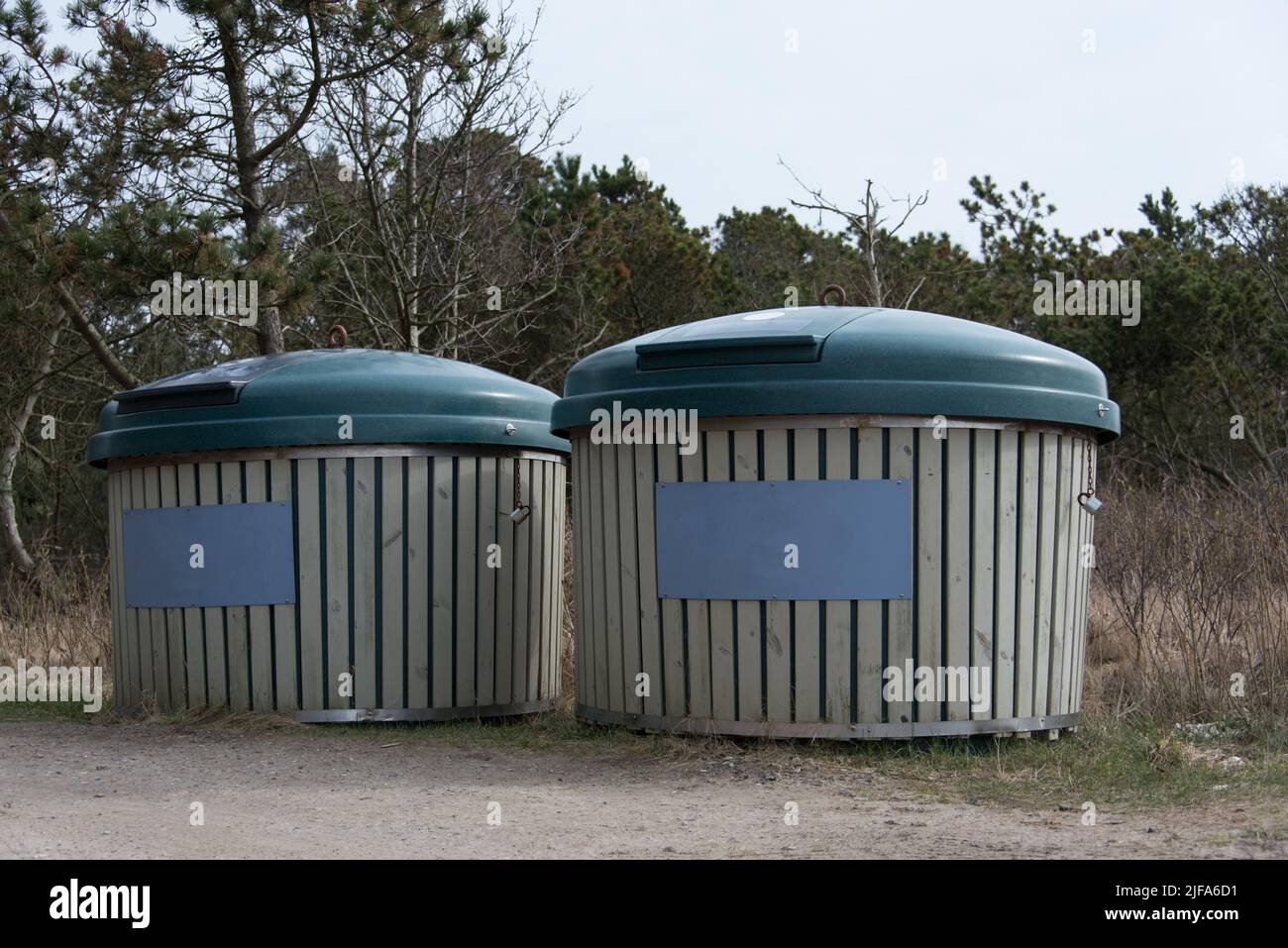 Two large recycling containers with empty blue-grey signs Stock Photo ...