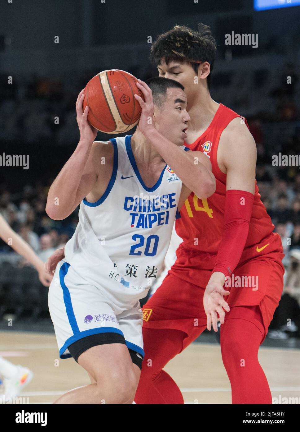 Szu-Yao Sun (L) of Chinese Taipei Basketball team and Zhelin Wang (R) of China Basketball team ...